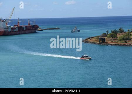 The crew of the coastal patrol boat USCGC Haddock (WPB 87347) tows a ...