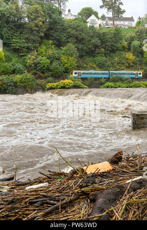 The water flow passes the weir from the upper level to lower level the ...