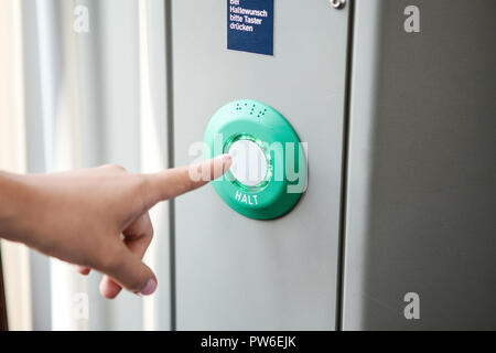 Emergency train stop button sign on the platform of a Japanese railway ...