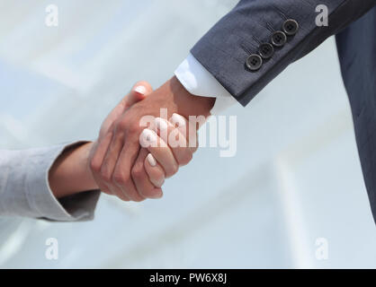 Excited smiling businessman handshaking partner at meeting Stock Photo ...