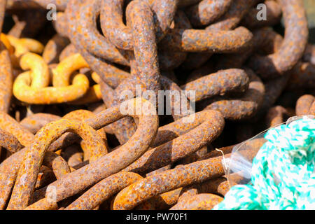 A pile of rusting chains used to weigh down fishing nets on the ...