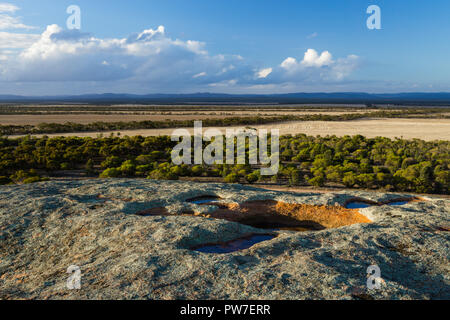 Shallow rock pools aka as gnamma holes by the aboriginals filled with ...