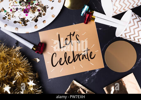 Red paper with lets have fun handwriting. Arrangement of pink peony ...