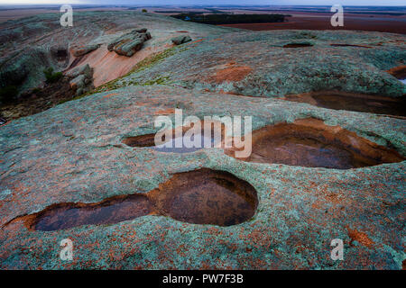 Shallow rock pools aka as gnamma holes by the aboriginals filled with ...
