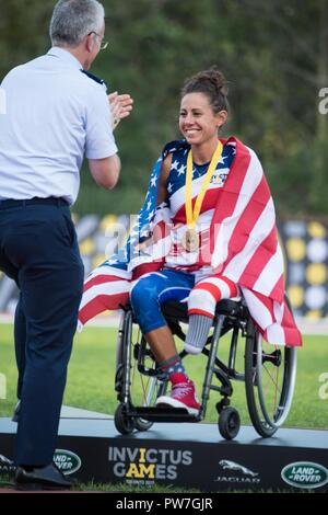 U.S. Army Capt. Kelly Elmlinger (left), San Antonio and U.S. Army Staff ...