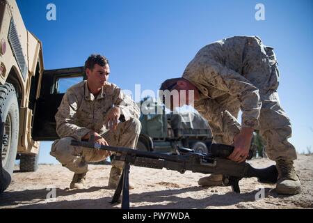 U.S. Marines with the Advanced Machine-Gun Course, complete firing an ...