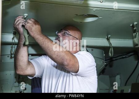 Henry Benefield installs straps in a M113A3/BMP-2 Opposing Forces ...
