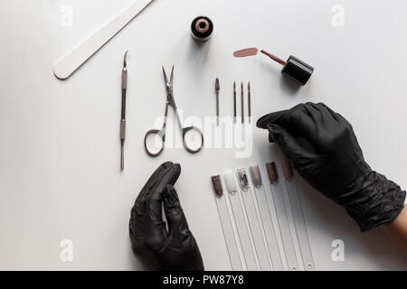 closeup view of the nail-care product and nail polishes at the salon ...