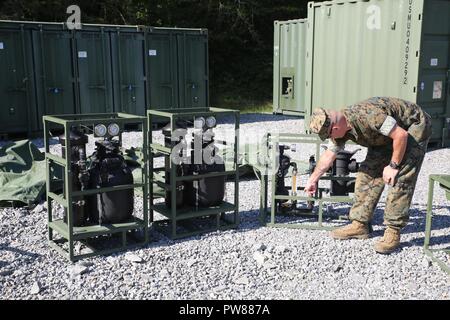 Master Sgt. Ryan Miller, project officer for Family of Water Systems at ...