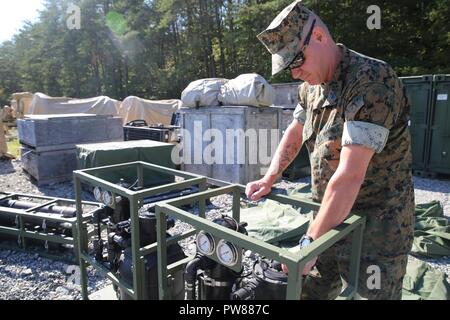 Master Sgt. Ryan Miller, project officer for Family of Water Systems at ...