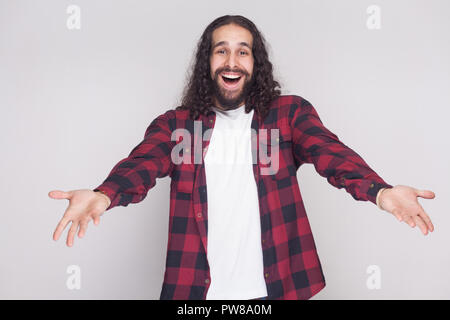 Arab man with beard holding welcome doormat smiling and laughing hard ...