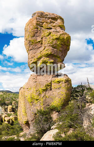 Balancing on a rock in the mountains Stock Photo - Alamy