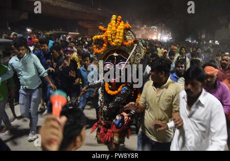 A Hindu man dances during a procession to celebrate the opening of a ...