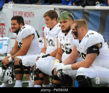 Central Florida offensive lineman Cole Schneider (65) looks to block ...