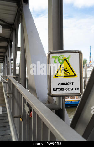 Information sign, Caution - danger of slipping, Berlin, Germany Stock ...