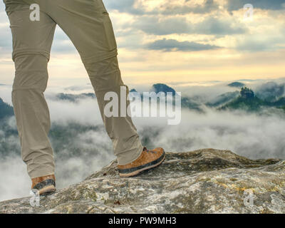 feet in hiking boots jumping in the field Stock Photo - Alamy