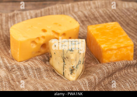 Different Italian cheese on sackcloth, on wooden background Stock Photo ...