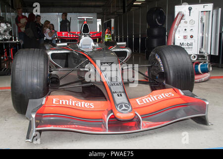 Mercedes team crew work on a car during a Formula One pre-season test ...