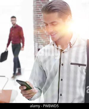 employee reads a text message on smartphone Stock Photo - Alamy