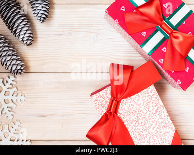 Christmas theme with fir cones along with gift box on the wooden ...