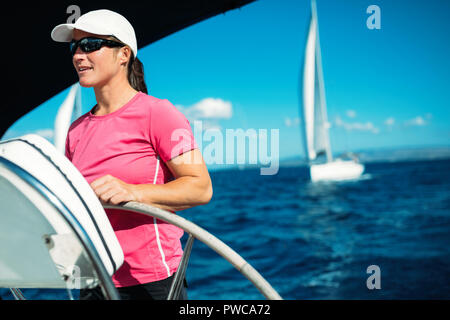 Happy strong woman sailing with her boat Stock Photo - Alamy