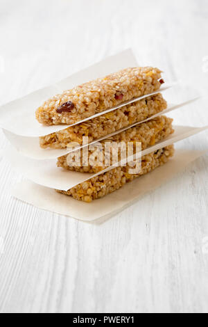 Granola bars on baking sheet over white wooden background, overhead ...