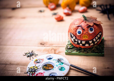 Happy Halloween. Werewolf or zombie hands painting scary pumpkin for ...