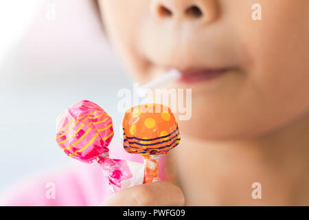young girl holding candy stick colorful prepare suck and hold teddy ...
