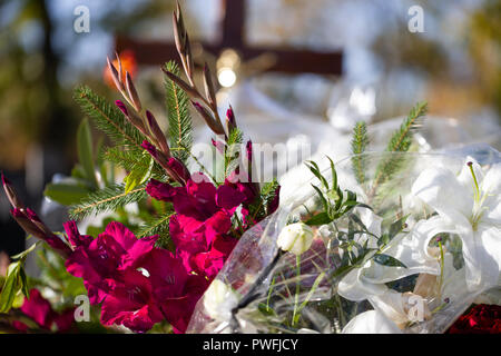 Flowers and candles on a colorful polish cemetery. Autumn, preparations ...