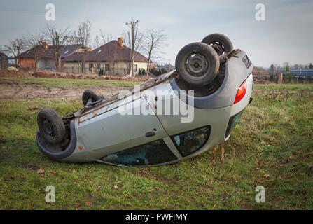 Traffic accident, car after rollover lie on the roof Stock Photo - Alamy