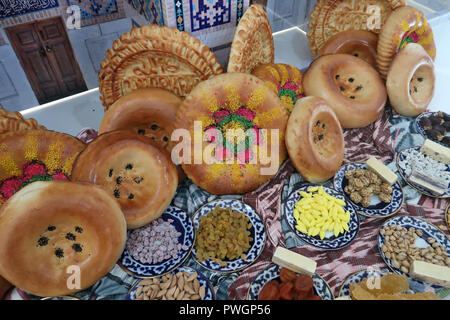 Traditional Uzbek non or naan oven-baked flatbread in Tashkent, capital ...