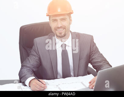 engineer is studying the draft,sitting behind a Desk.isolated on white ...