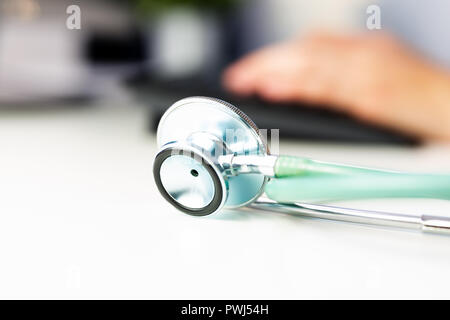 Stethoscope on keyboard on white table background. Online medical ...