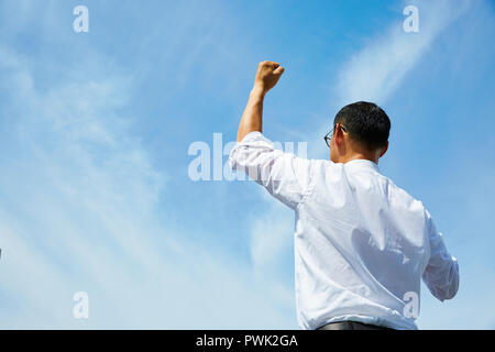 Japanese salaryman against blue sky Stock Photo - Alamy