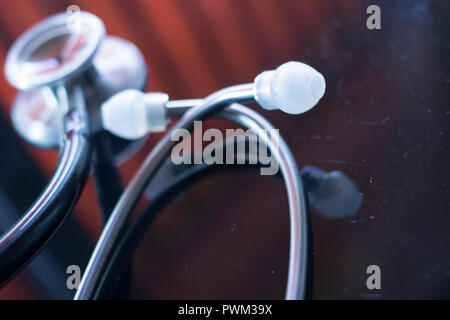 Medical doctor's stethoscope used to listen to patient heart rate ...