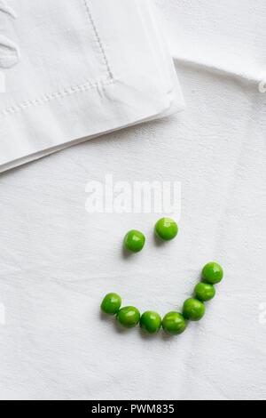 happy smiley face out of peas Stock Photo - Alamy