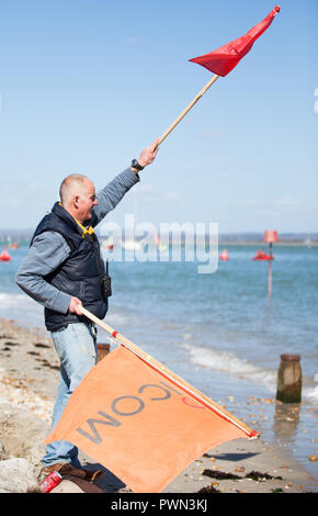 Man waving off a water sport racer Stock Photo - Alamy