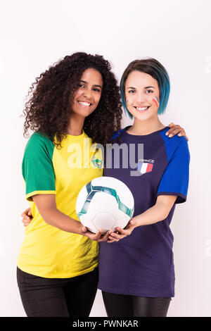 Portrait of two young fans of the Brazilian team and the French ...