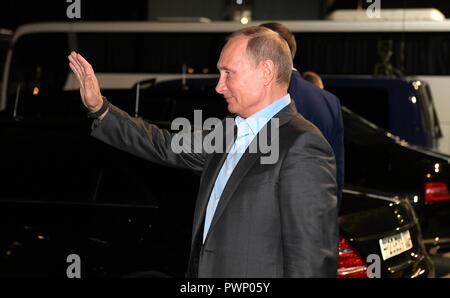 Russian President Vladimir Putin waves after his annual news conference ...
