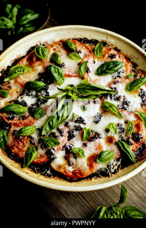 Caprese Black Rice Casserole served in a ceramic bowl. Photographed on ...