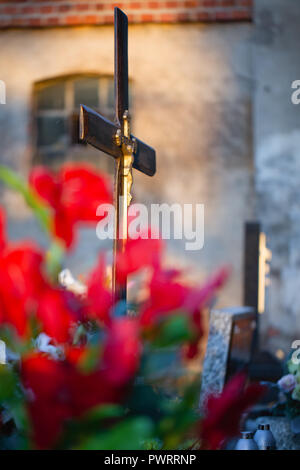 Flowers and candles on a colorful polish cemetery. Autumn, preparations ...