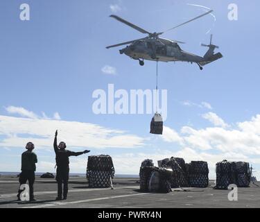 Airmen assigned to the 6th Operations Group stand in formation during ...