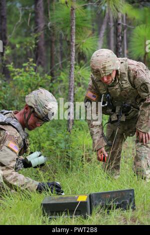 A U.S. Army Soldier, assigned to the 752nd Ordnance Company, adjusts ...