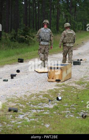 A U.S. Army Soldier, assigned to the 752nd Ordnance Company, adjusts ...