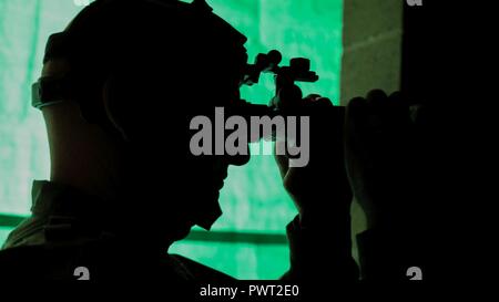 A U.S. Army Soldier, assigned to the 752nd Ordnance Company, adjusts ...
