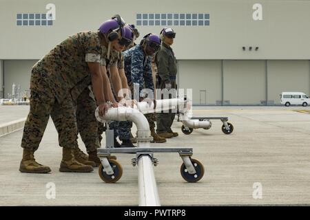 U.S. Marines and Master Labor Contractors with the Logistics Department ...