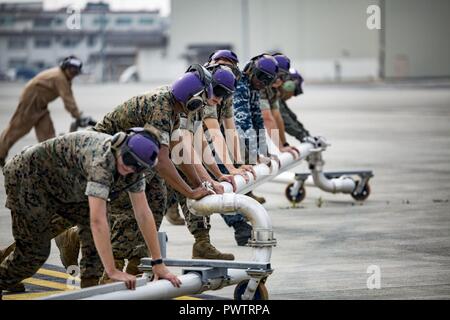 U.S. Marines and Master Labor Contractors with the Logistics Department ...