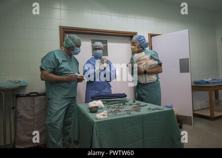U.S. Army Maj. Christina Riojas, a general surgeon, works with a ...