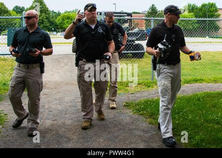 US Navy Fire assessment members use a naval firefighting thermal imager ...