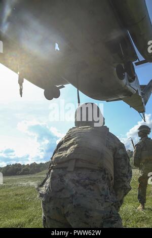U.S. Marine Corps Pfc. Tristan Doran poses for a photo with his family ...